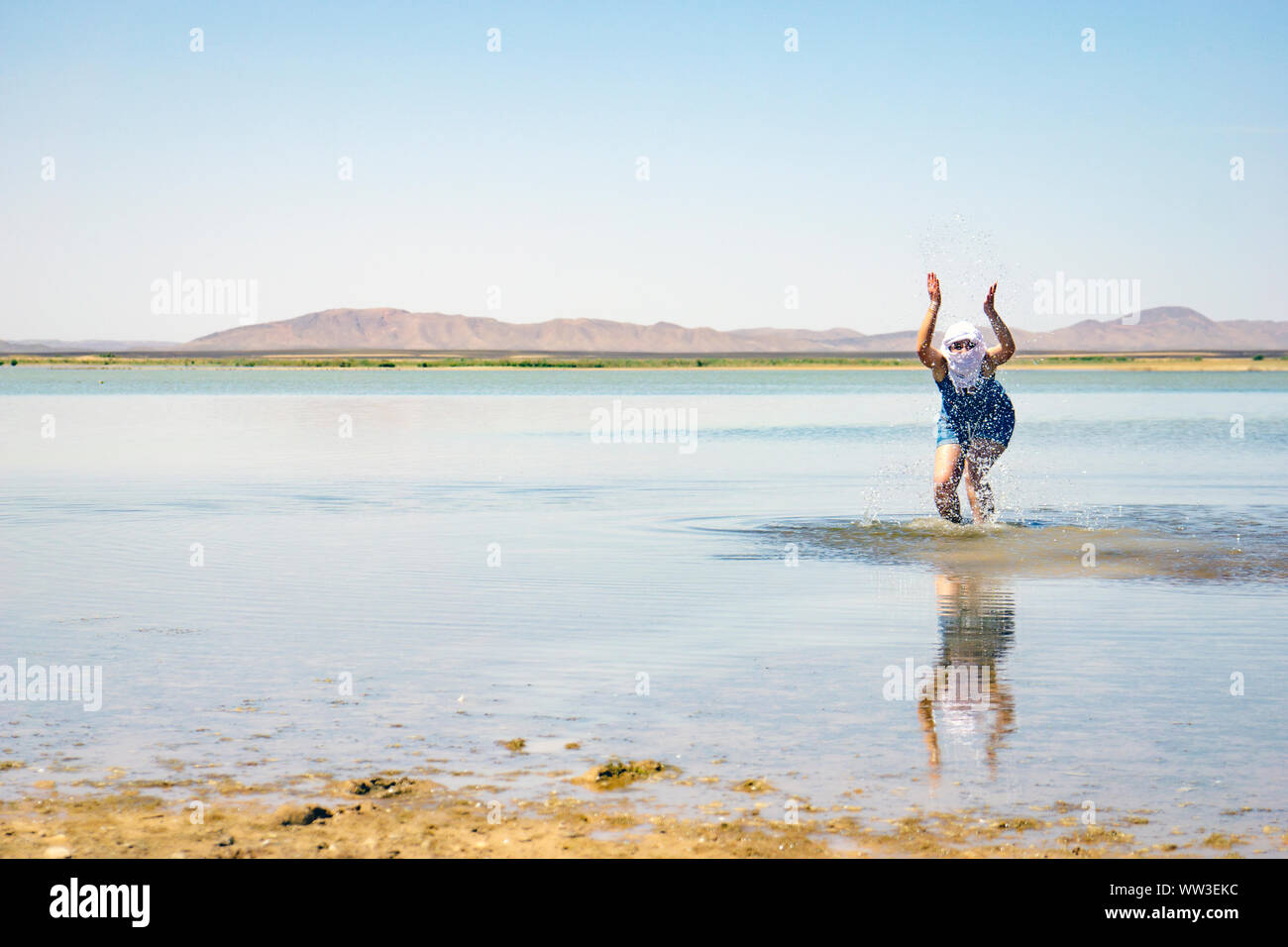 young woman in a desert oasis Stock Photo - Alamy