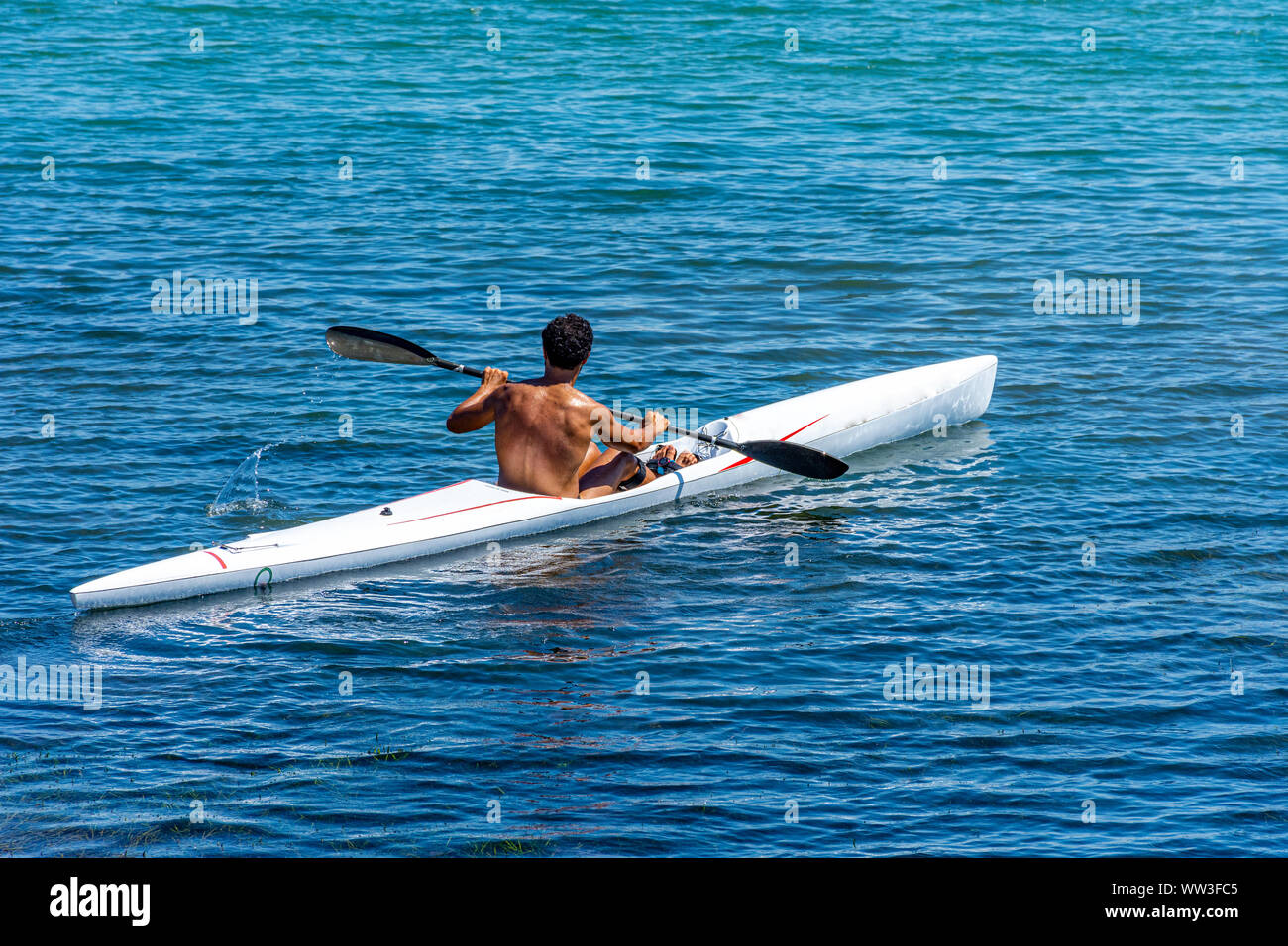 Athlete man trains in a canoe Stock Photo - Alamy