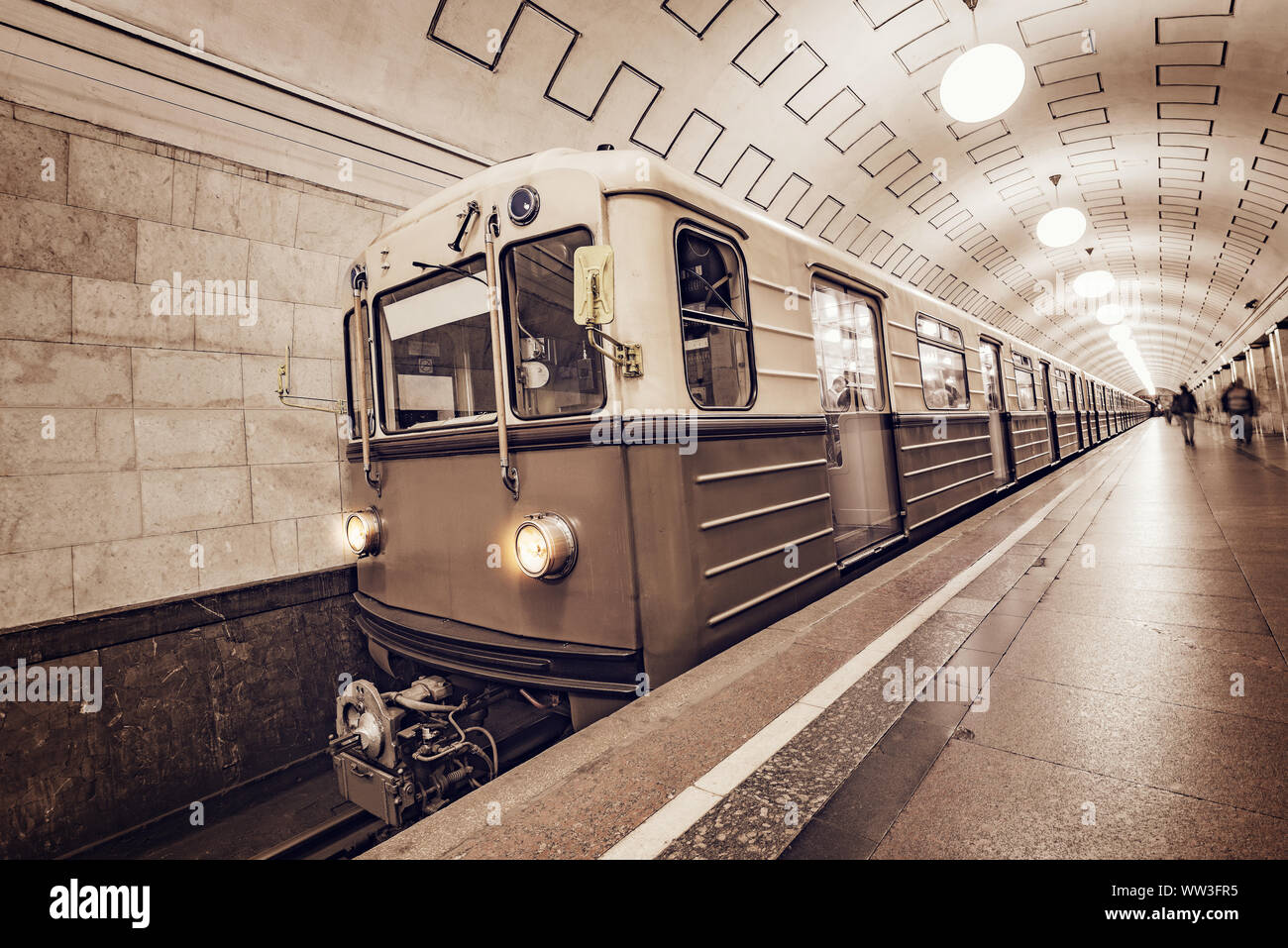 Retro subway train stands by the platform Stock Photo - Alamy