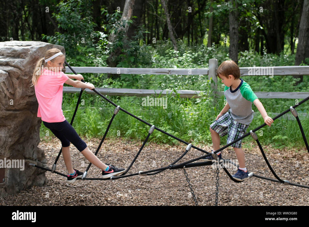kids playing on rope bridge Stock Photo - Alamy