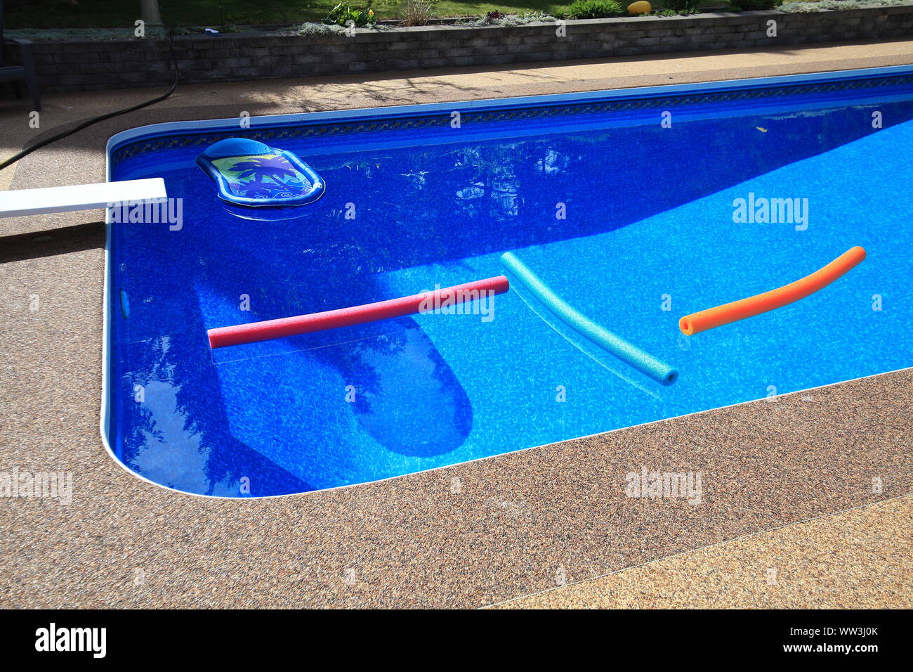 Empty private pool with toys from the last visitors Stock Photo - Alamy