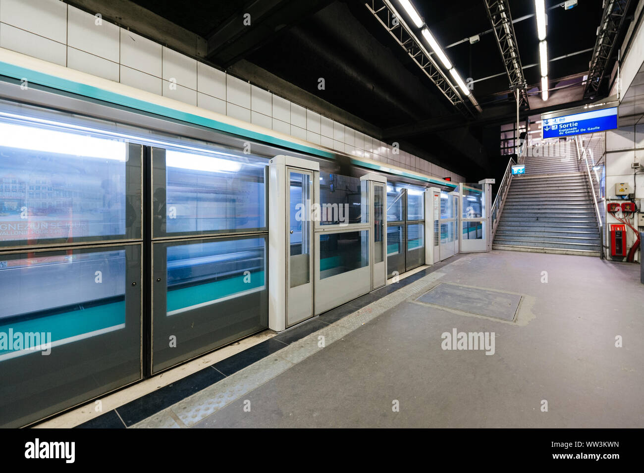 Paris, France - Jul 14, 2011: Fast Parisian Metro train passing behind ...