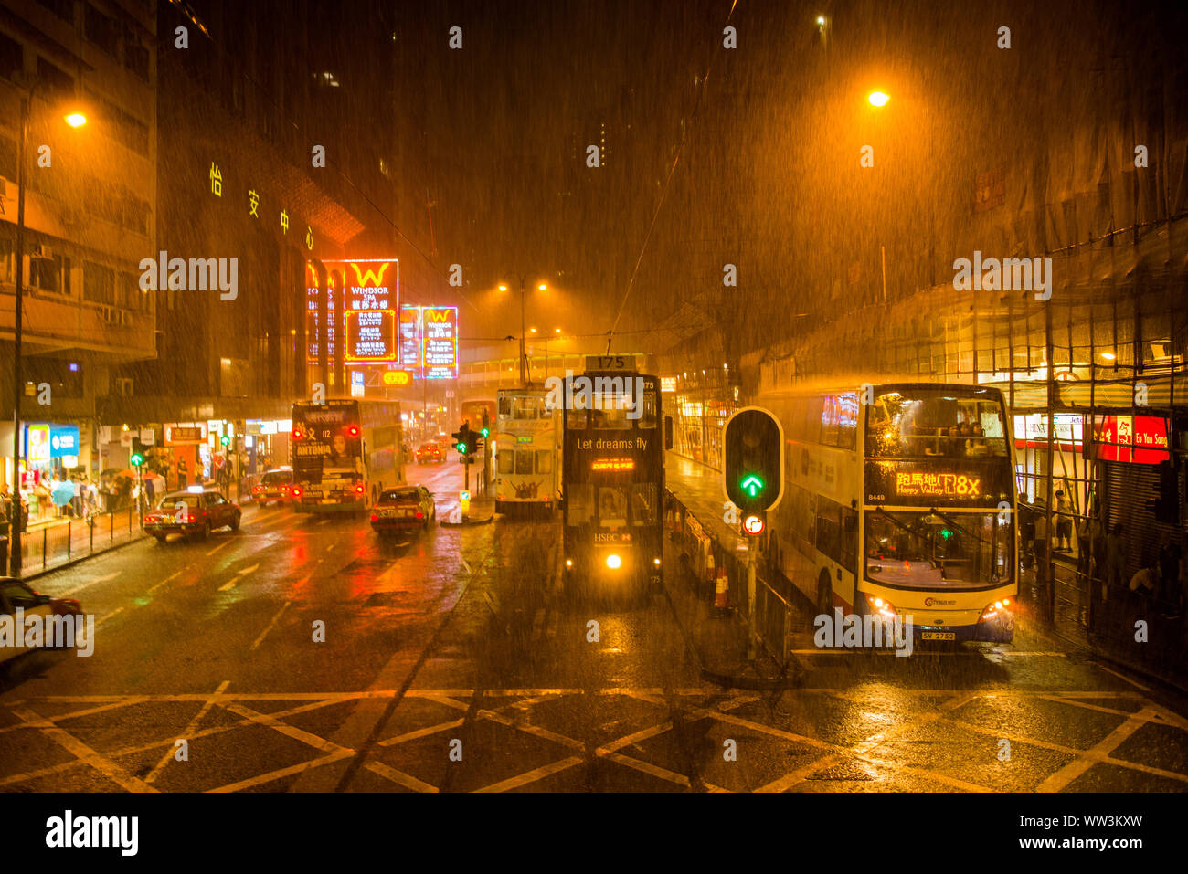 Hong Kong buses in a raining evening Stock Photo - Alamy