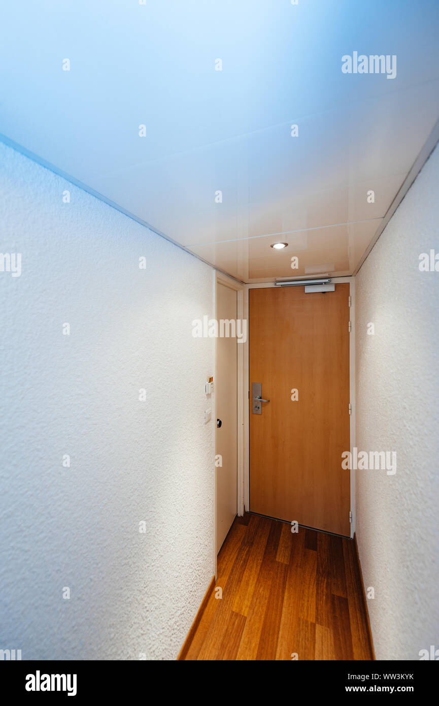 Interior of large corridor of modern hotel room with beautiful parquet ...