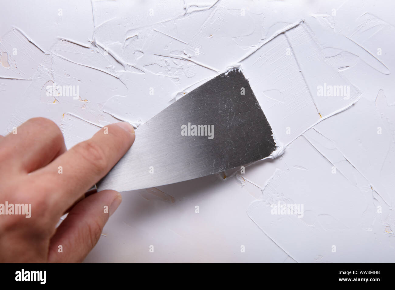 Using a paint scraper hi-res stock photography and images - Alamy