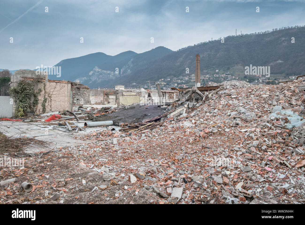 Demolition of buildings in urban environments. On background green ...