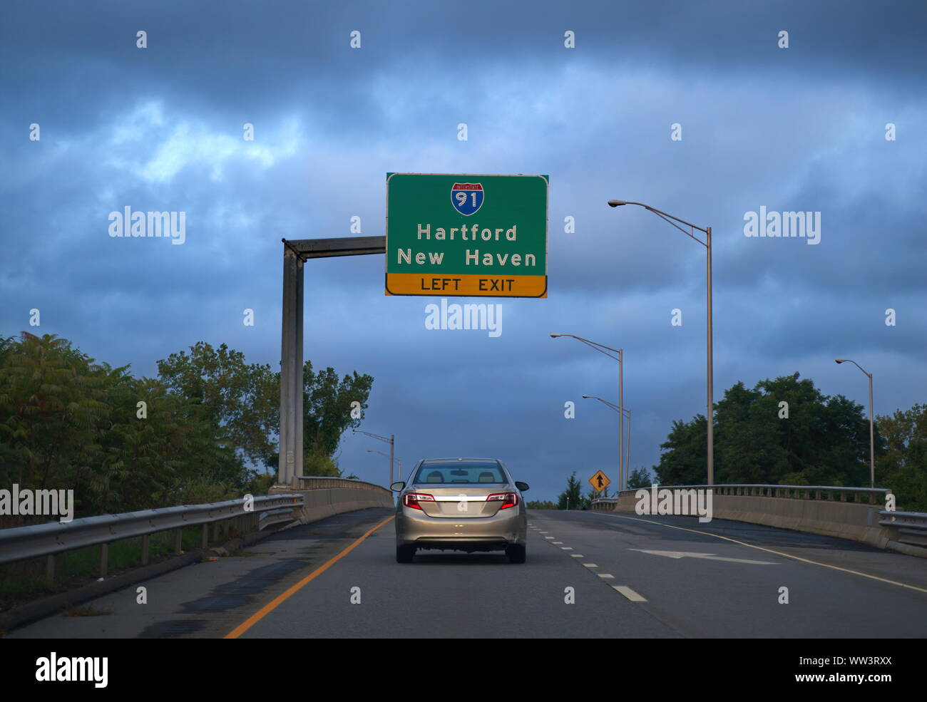Wethersfield, CT USA. Sep 2019. Interstate 91 freeway sign and a merging car. I91 provides New ...