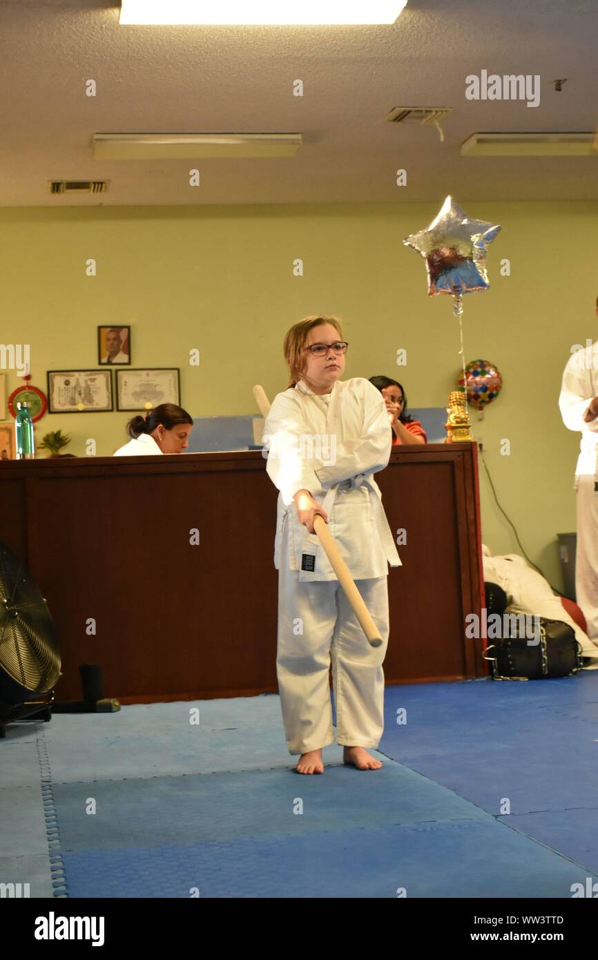 This action photo is of my daughter in her Karate class. Karate is a ...