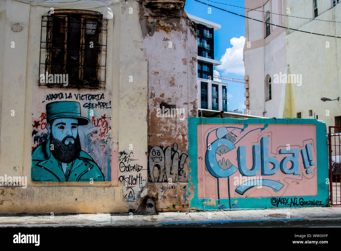 Cuban graffiti artwork on street corner featuring Fidel Castro and Cuba ...