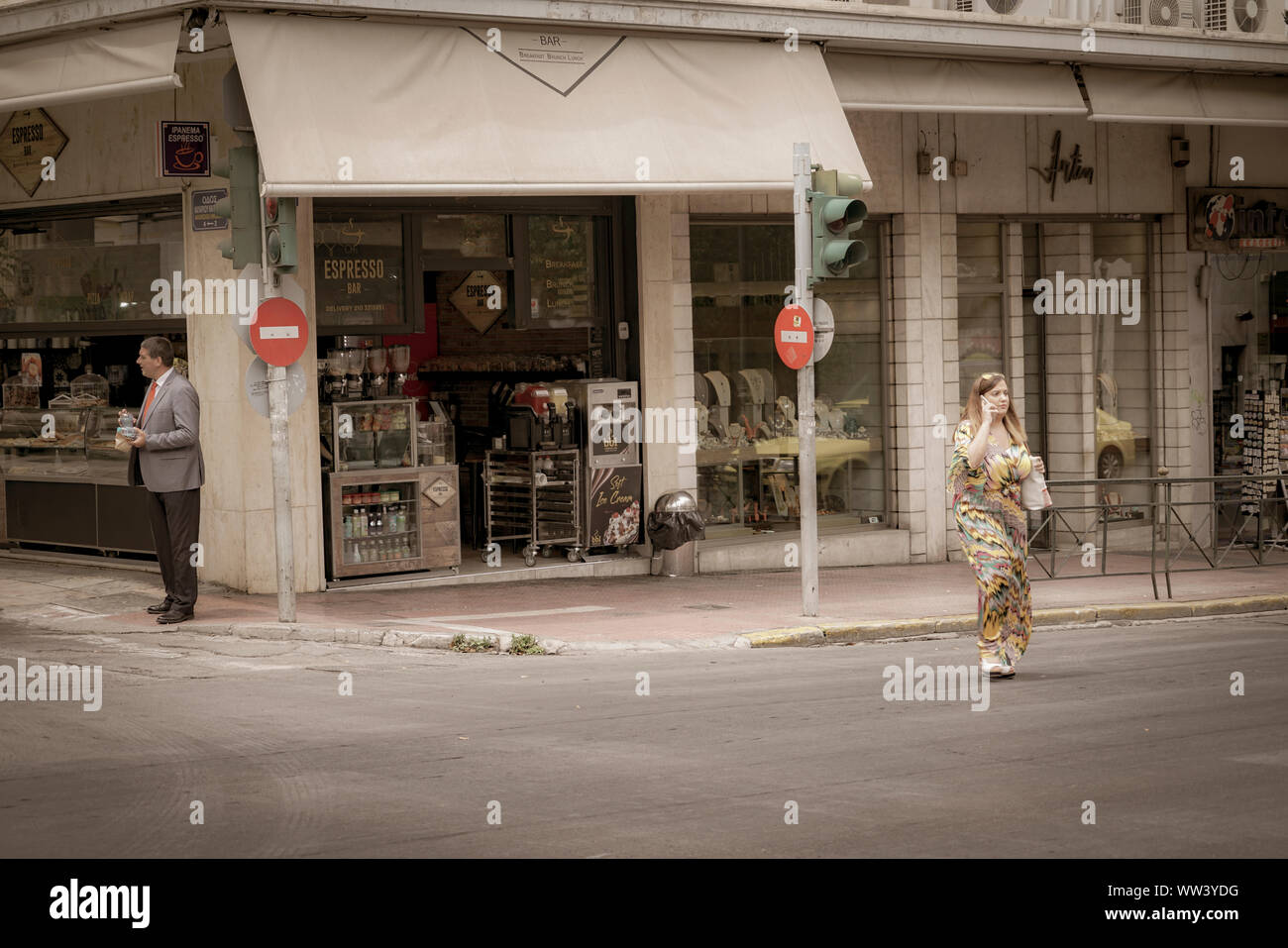 ATHENS GREECE - JULY 15 2019; Man on one side of corner waiting and ...