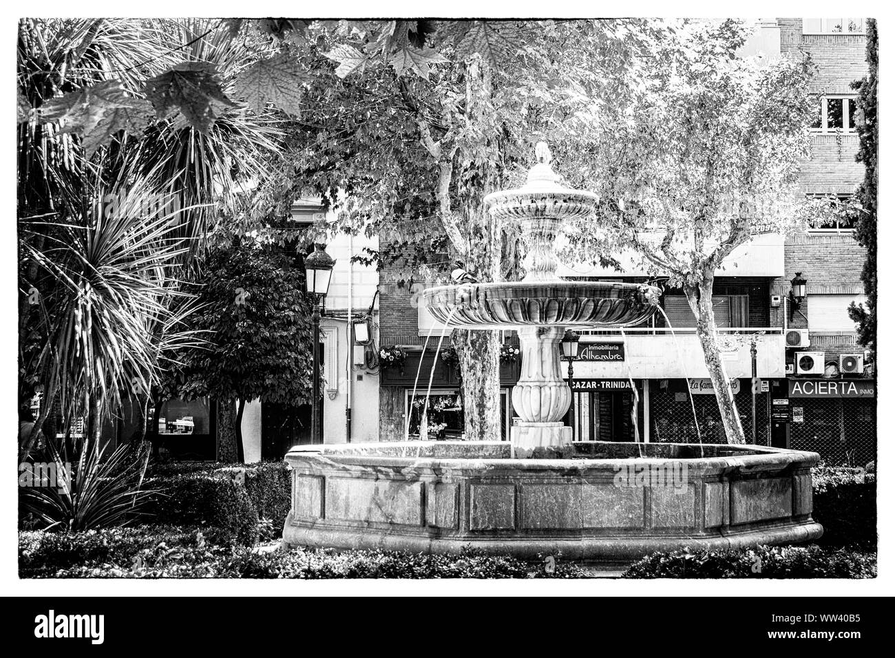 A black and white image of a water fountain; Granada, Spain Stock Photo ...