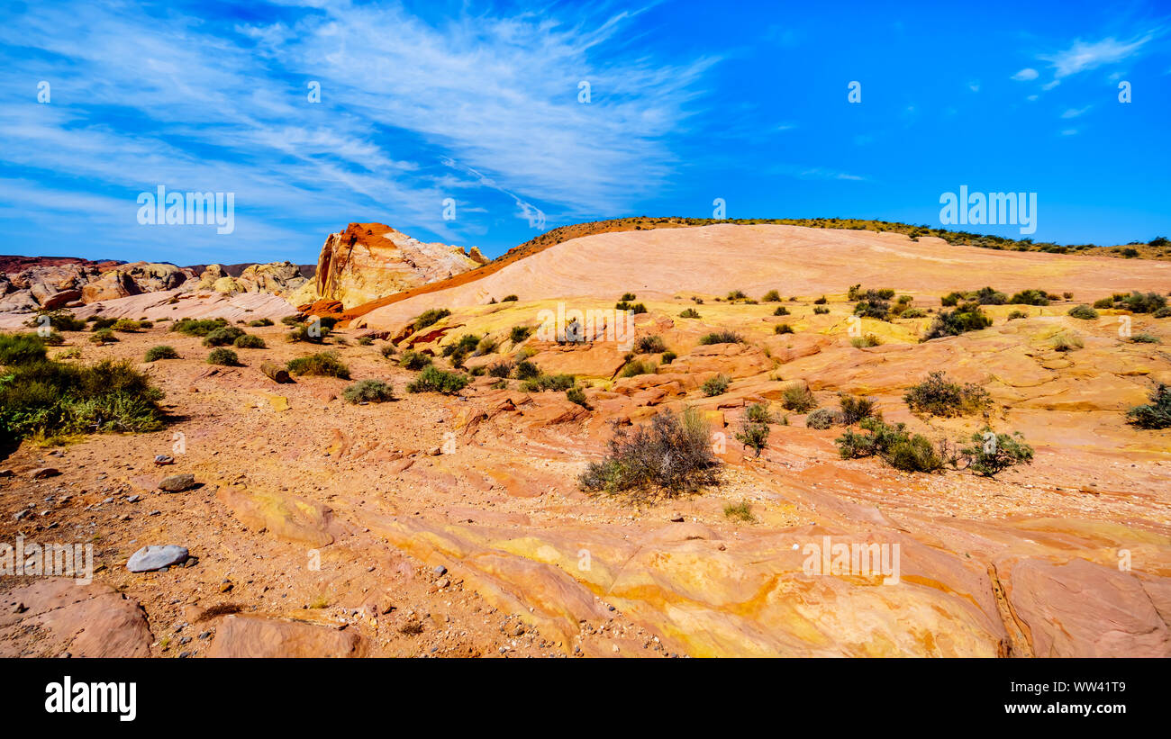 The colorful red, yellow and white banded rock formations along the ...