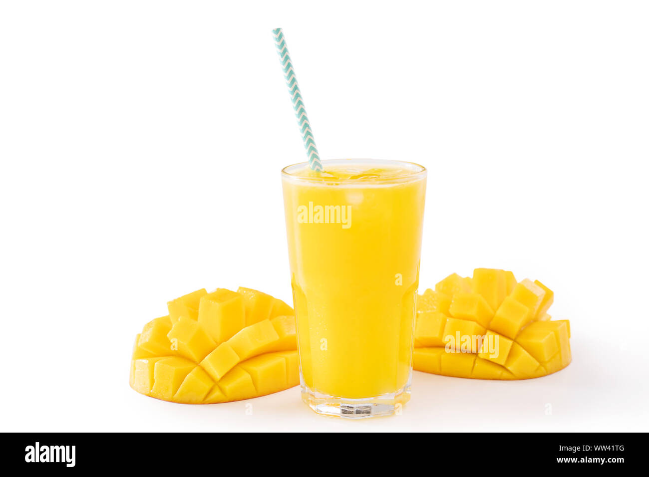 Fresh tropical mango juice with beautiful diced pulp and striped paper ...