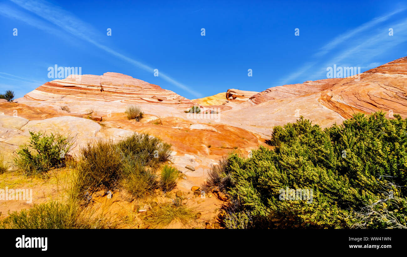 The colorful red, yellow and white banded rock formations along the ...