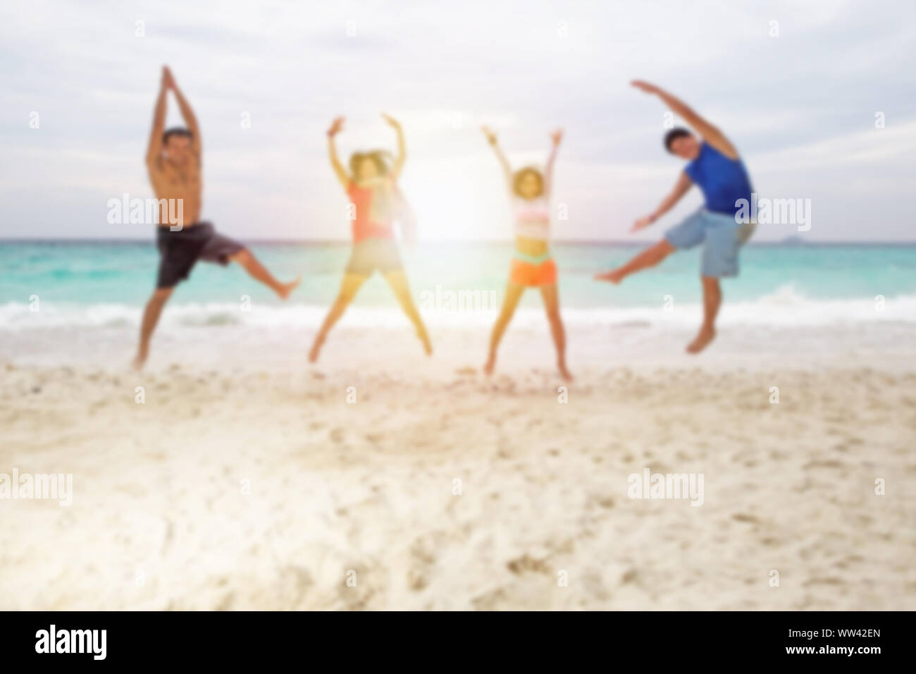 Group of happy people jump on the sea blur background, summer vacation ...
