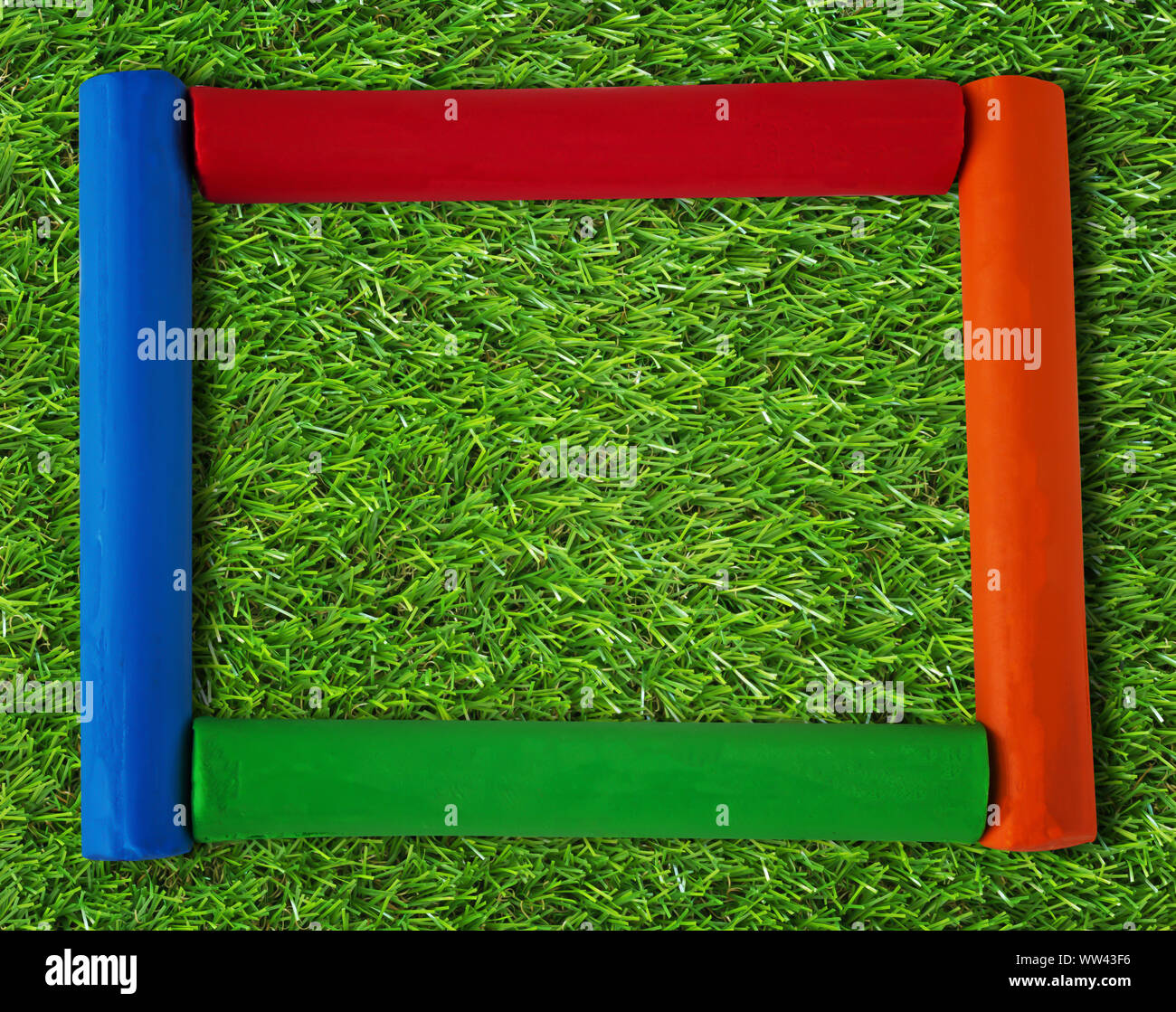 Creative clay frame on green grass background, education and nature ...