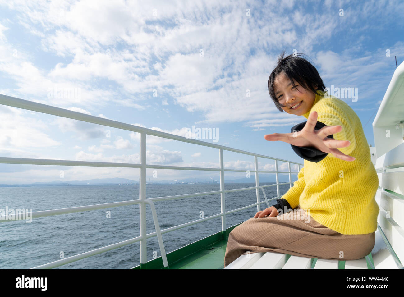 Girl on ship's deck Stock Photo - Alamy