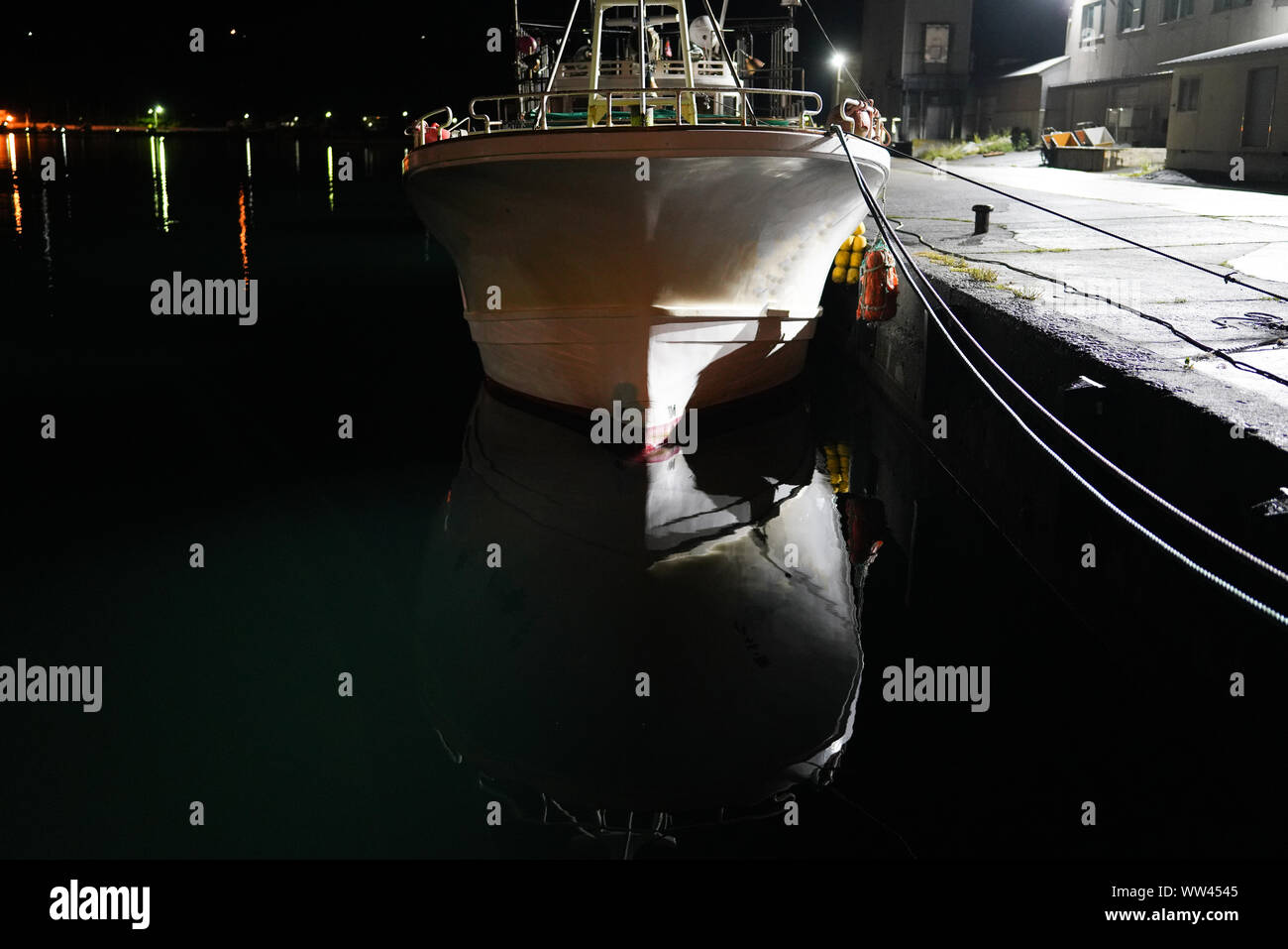 Fishing boat at night Stock Photo - Alamy