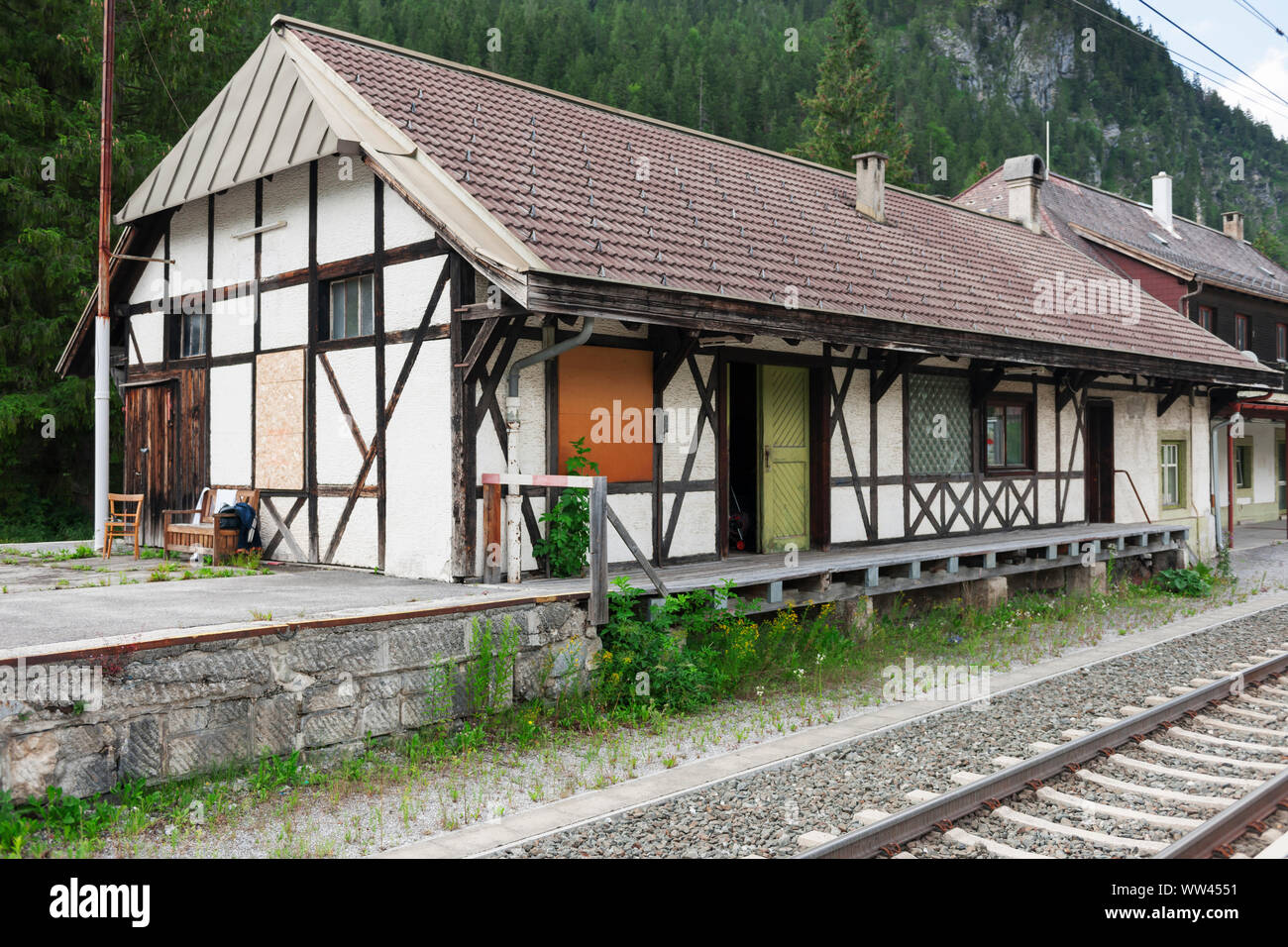 Small old half-timbered warehouse with ramp at a station with ...