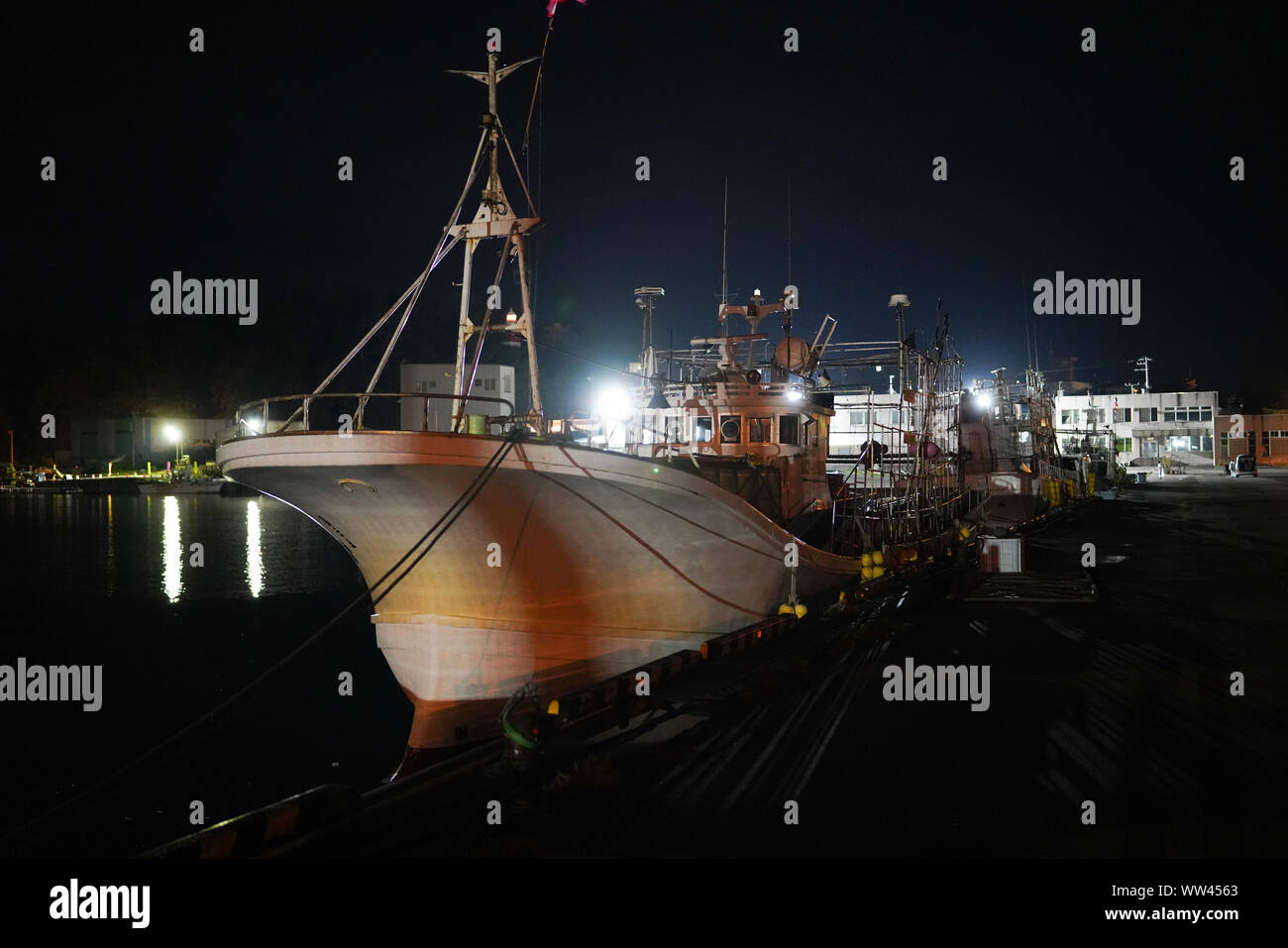 Fishing boat at night Stock Photo - Alamy
