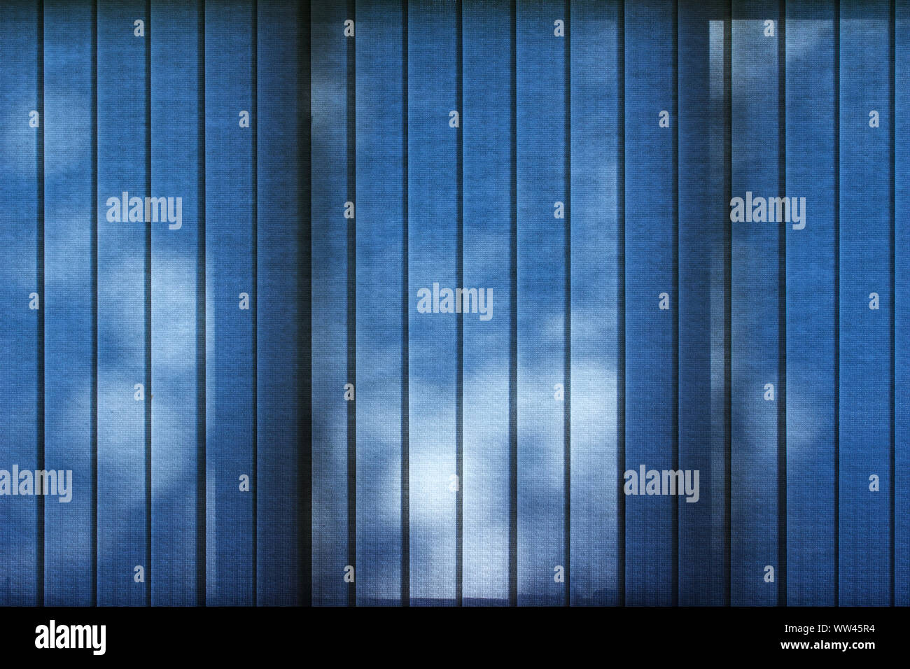 Abstract texture design of blue color vertical window blinds with light ...
