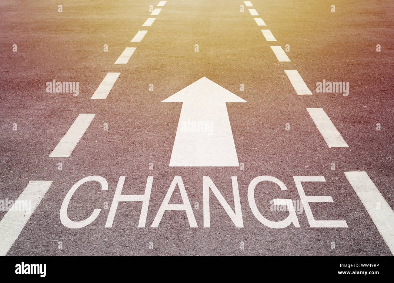 Business change concept, white arrow on road background Stock Photo - Alamy
