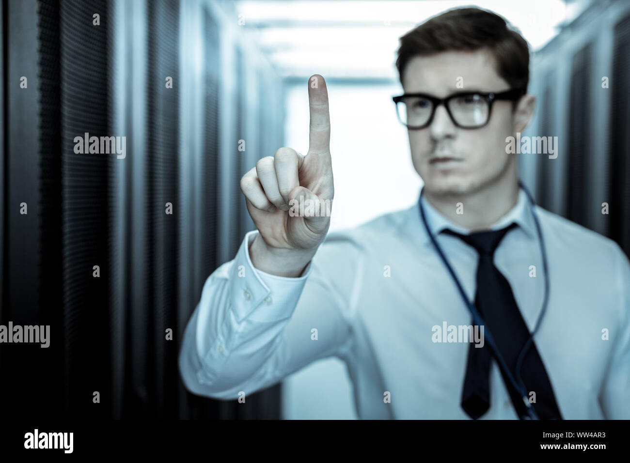 Short-haired security guard in a blue shirt looking attentive Stock ...