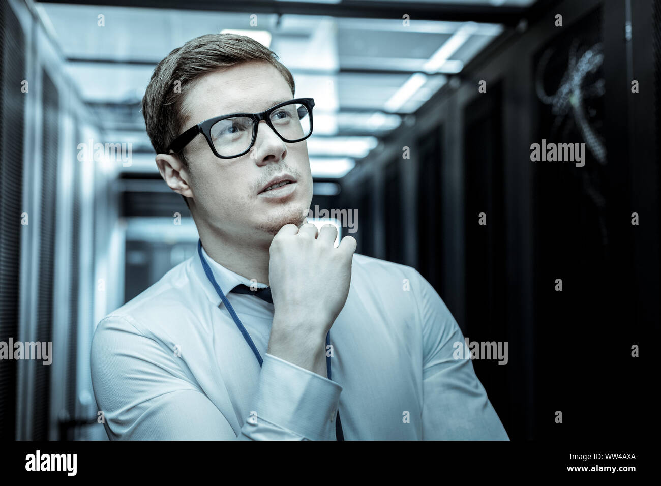 Professional detective with a tie looking attentive Stock Photo - Alamy