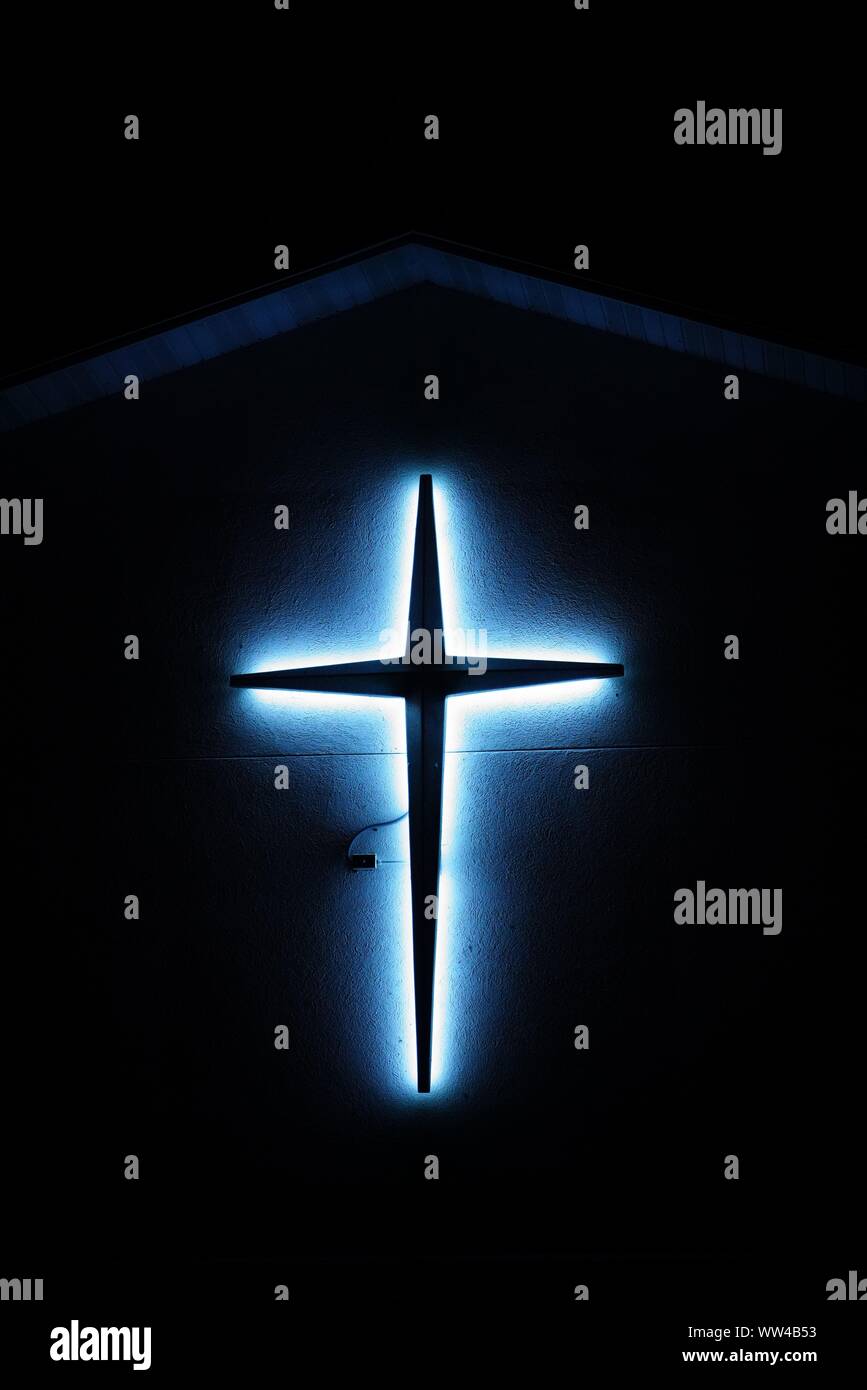 Beautiful Bright Neon Blue Cross on Side of a church building in ...
