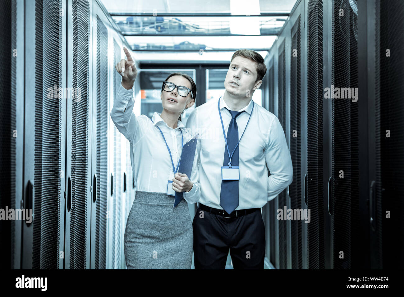 Long-haired detective explaining working process of wire-tapping Stock ...