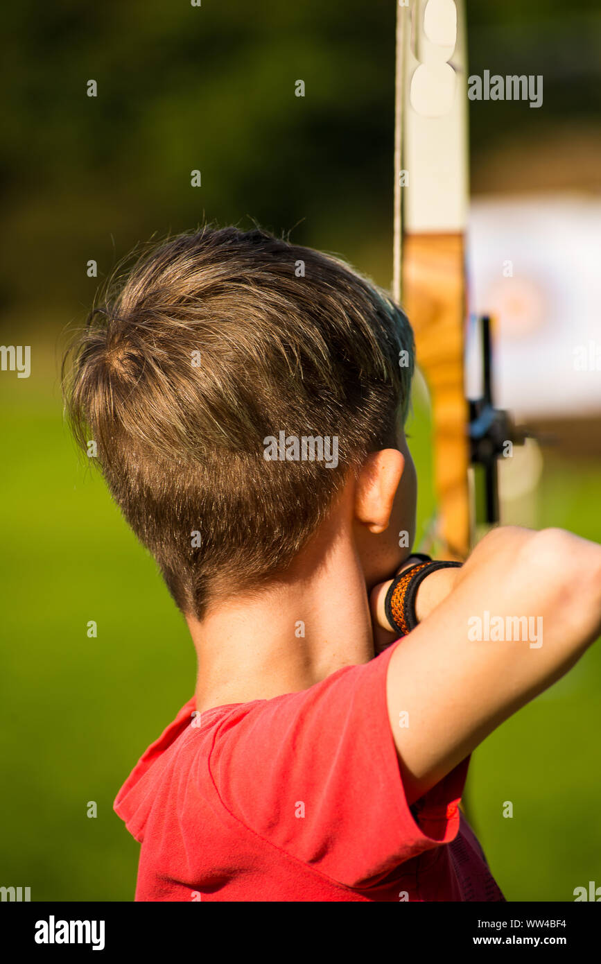 Boy practicing archery hi-res stock photography and images - Alamy