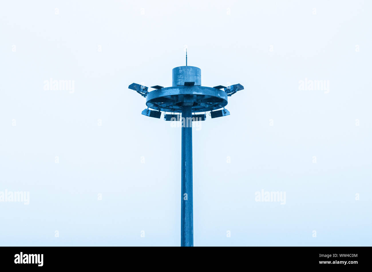 Large blue spotlight pole with pale white sky background Stock Photo ...