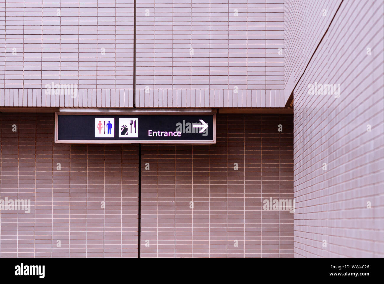 Airport information sign - lightbox sign with direction to toilet ...