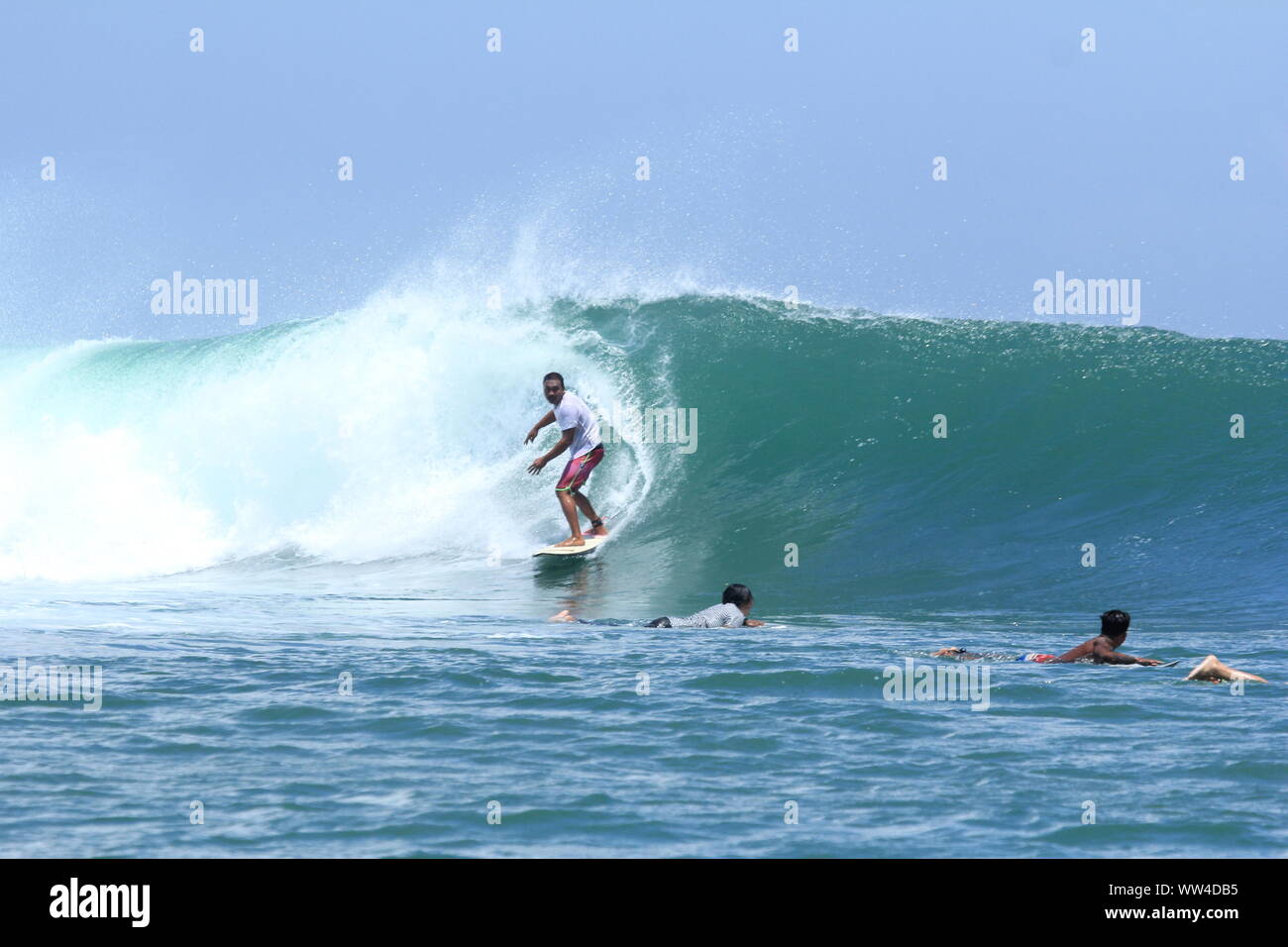 Free surf at Kuta reef Bali Stock Photo - Alamy