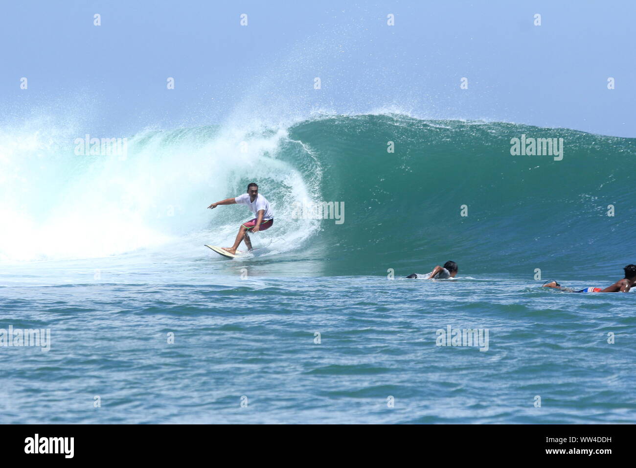 Free surf at Kuta reef Bali Stock Photo - Alamy