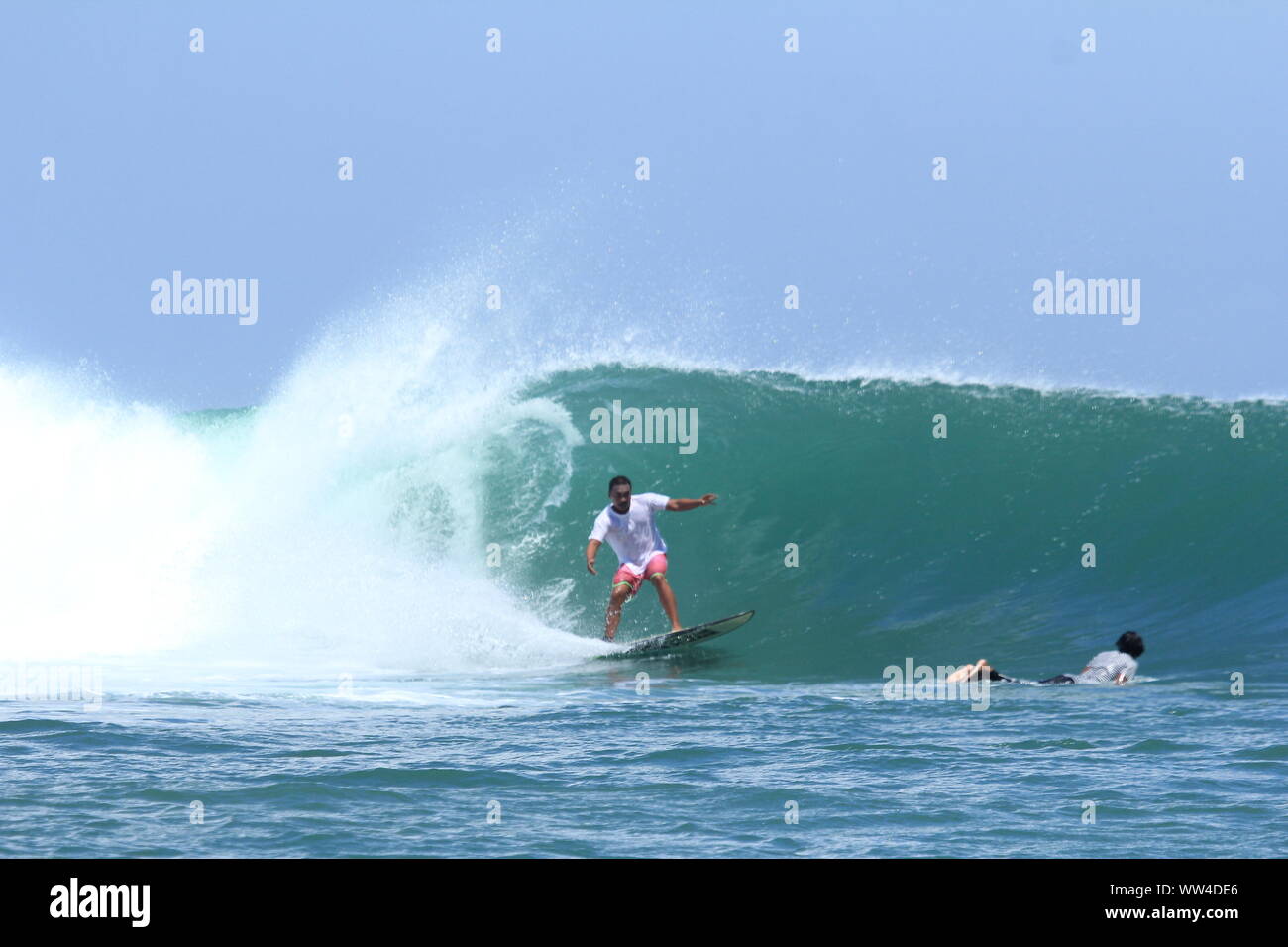 Free surf at Kuta reef Bali Stock Photo - Alamy