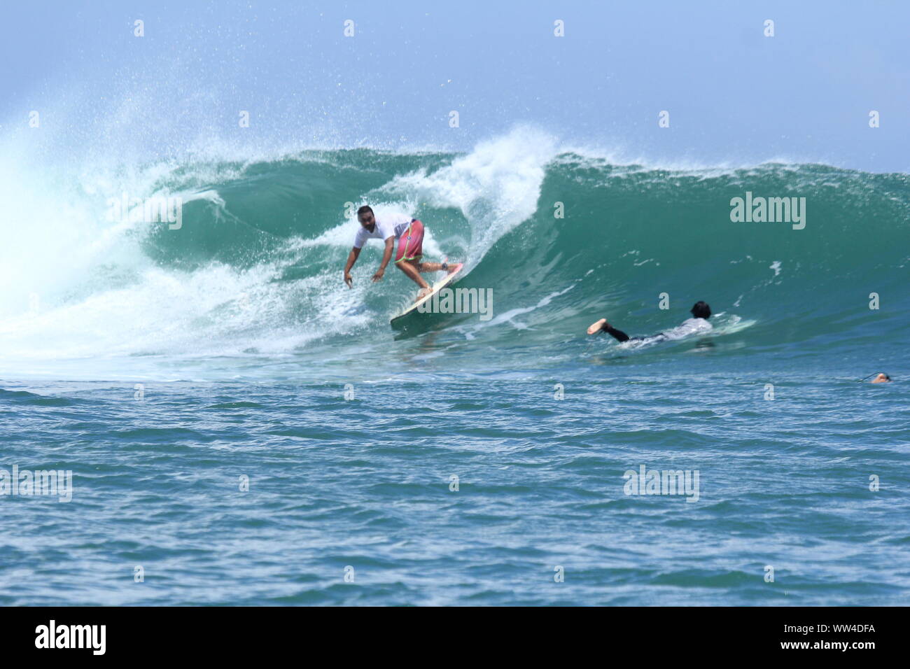 Free surf at Kuta reef Bali Stock Photo - Alamy