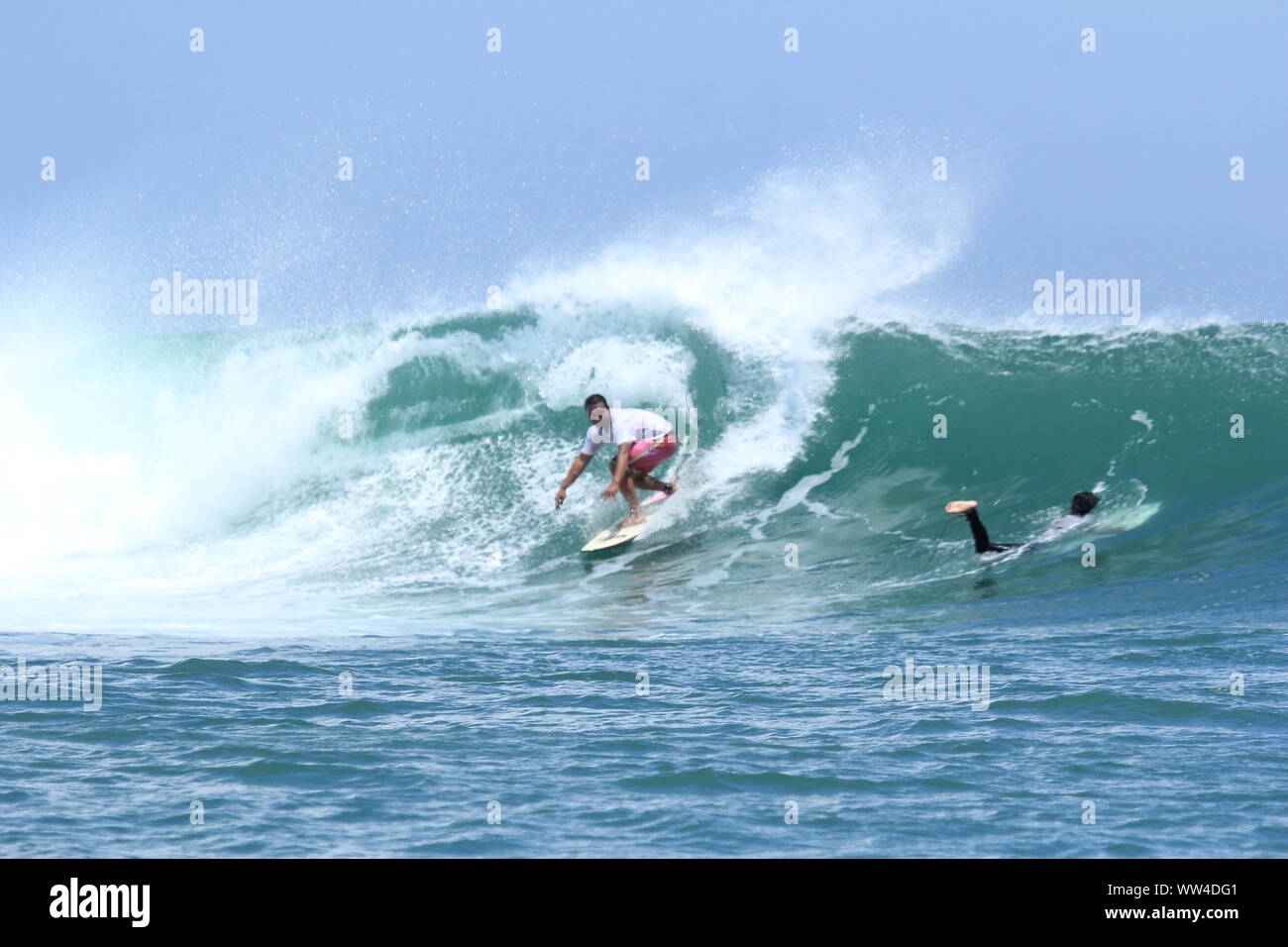 Free surf at Kuta reef Bali Stock Photo - Alamy