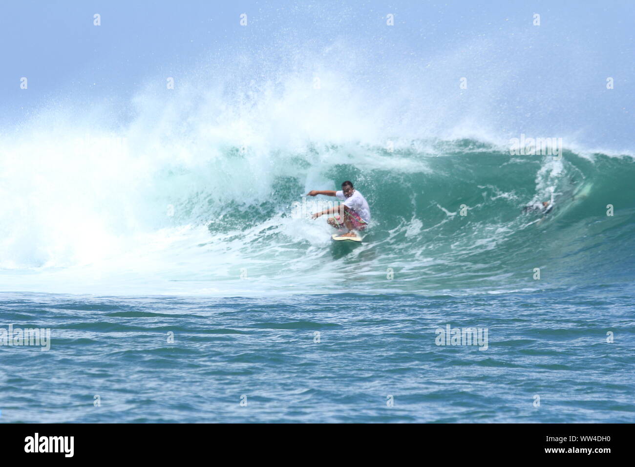 Free surf at Kuta reef Bali Stock Photo - Alamy