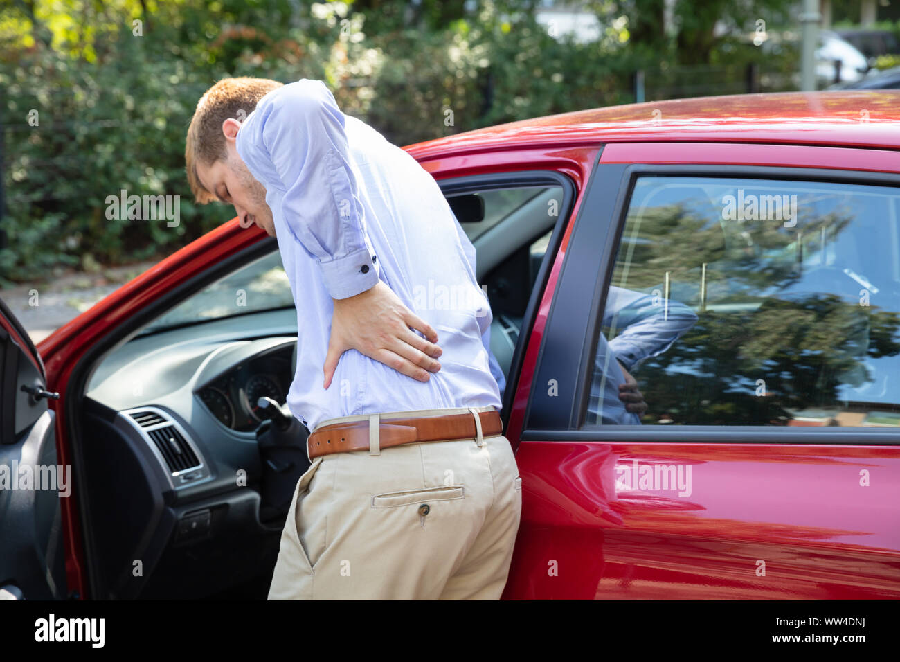 Driver Standing Having Backpain After Driving Car Stock Photo - Alamy