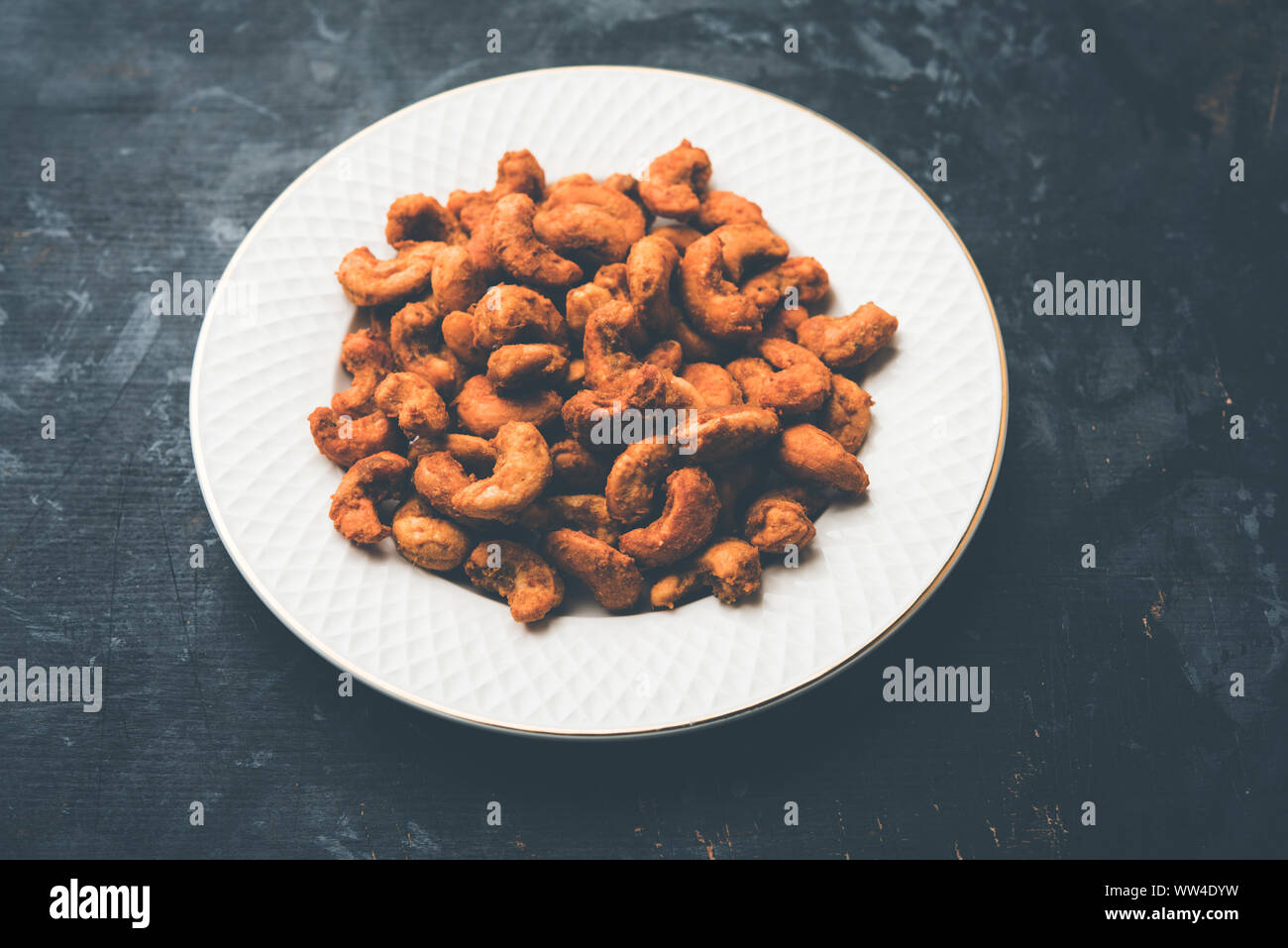 Masala Kaju or spicy Cashew in a bowl. Popular festival snack from ...