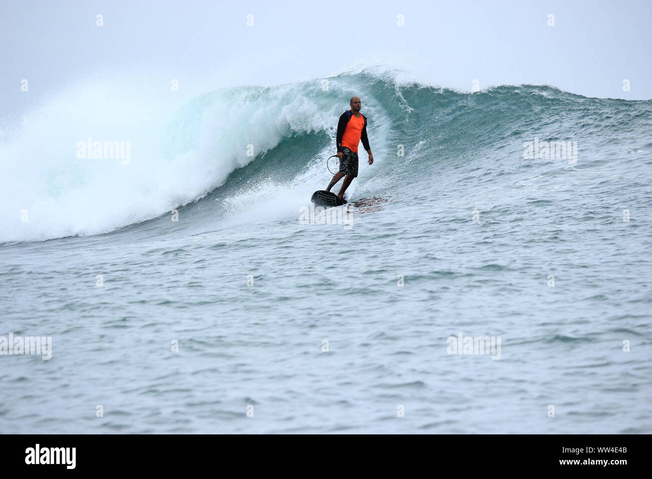Free surf at Kuta reef Bali Stock Photo - Alamy