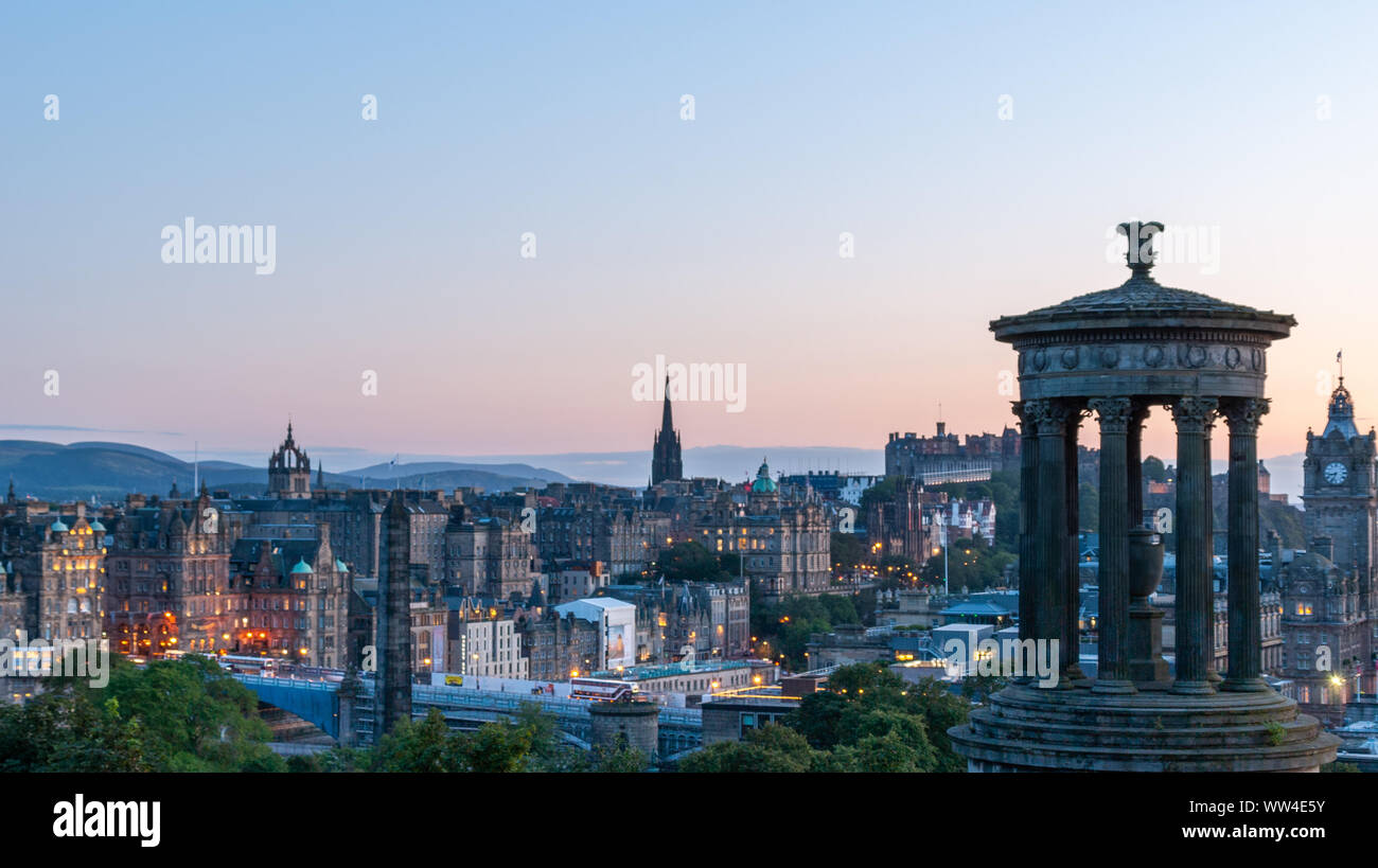 Scenic photo of principal monuments of Edinburgh at dusk during the ...