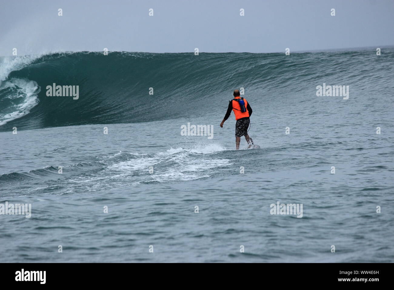 Free surf at Kuta reef Bali Stock Photo - Alamy