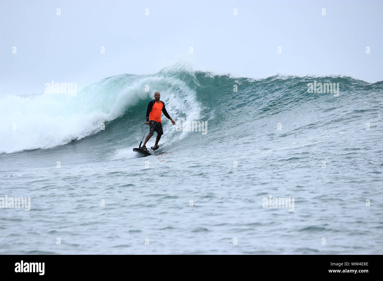 Free surf at Kuta reef Bali Stock Photo - Alamy