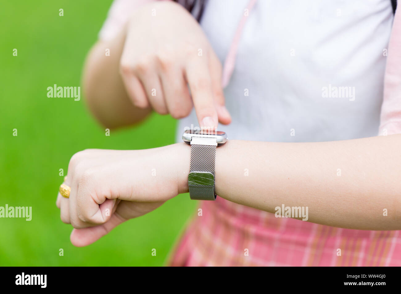 Smart watch closeup girl teen wist hand using watch touch screen Stock ...