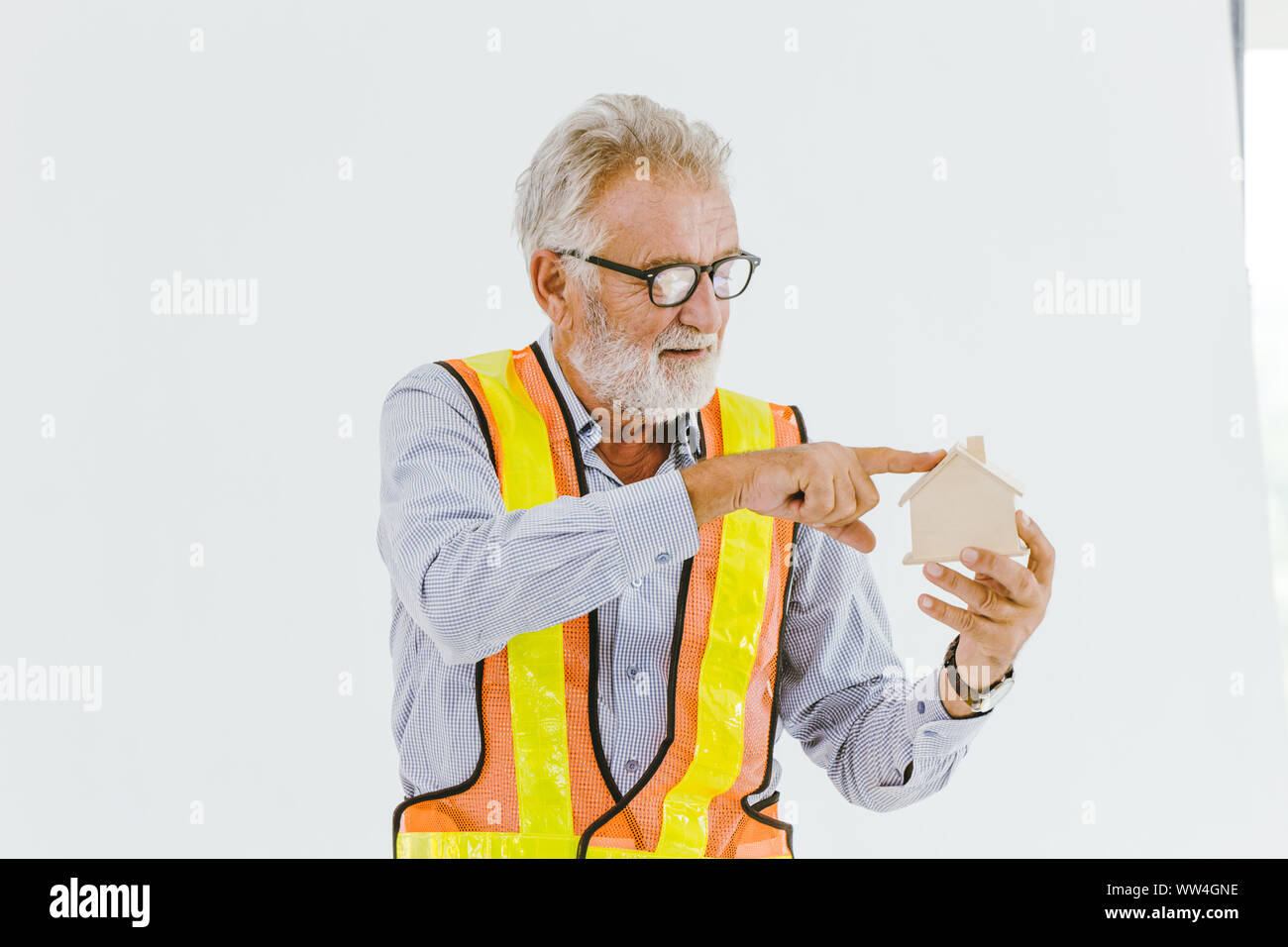 home engineer builder hand pointing at house model working with design ...