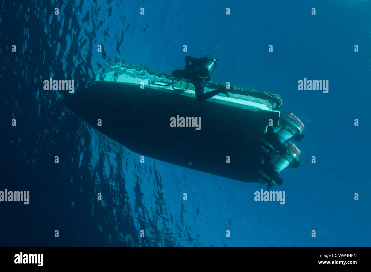 Diver and boat from below, Sebayor Kecil dive site, between Komodo and ...