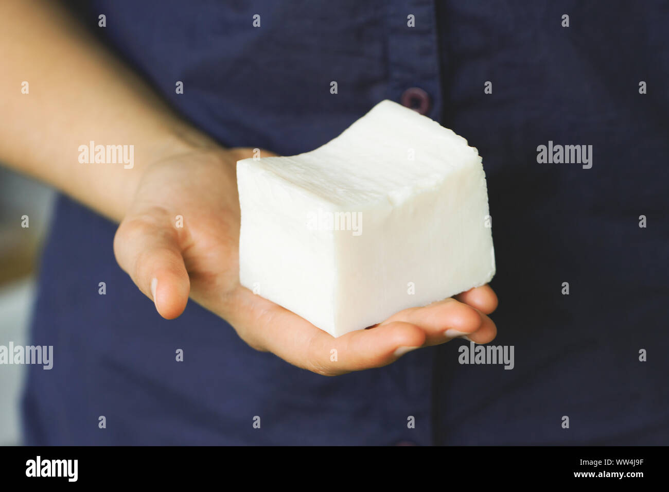 Organic laundry soap in the woman's hand. Zero waste concept, plastic ...