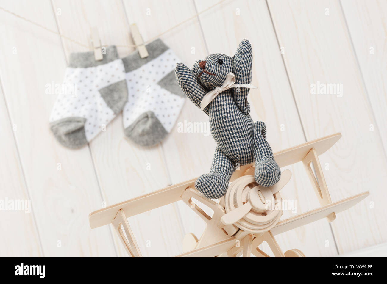 Cute teddy bear on wooden background with wooden baby toys Stock Photo ...